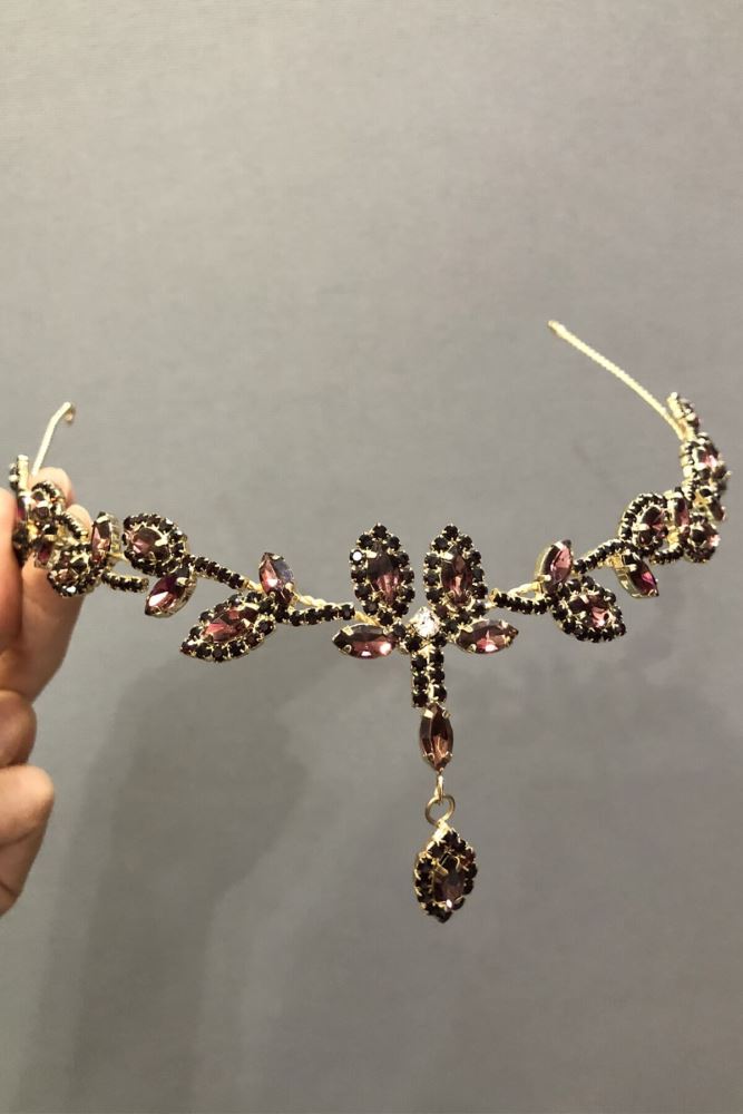 Gruis Model Plum Hair Accessory and Earrings.